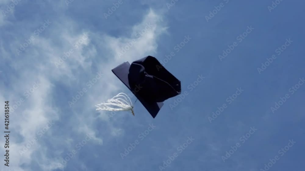 Single graduation cap flying in the air. Virtual graduation, social ...