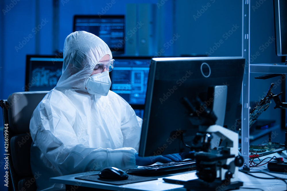 Microelectronics engineer works in a modern scientific laboratory on ...