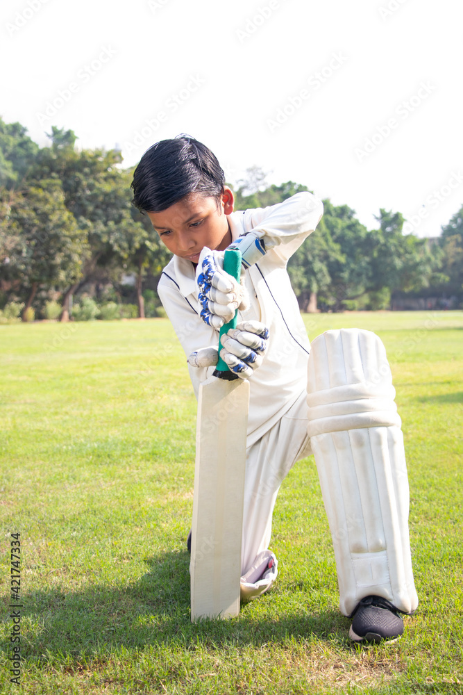Confident boy wearing cricket uniform and playing Cricket Stock Photo ...
