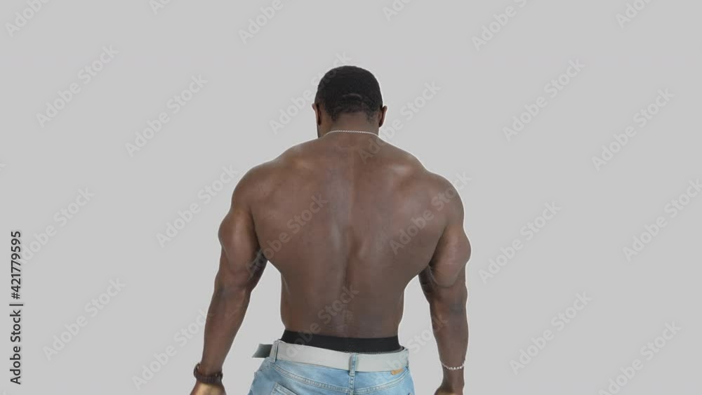 Back muscles of a black athlete. Shirtless african american sportsman ...
