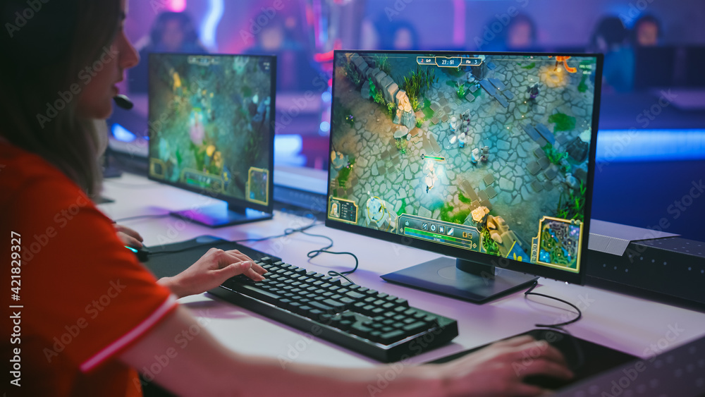 Pro Girl Plays Computer Game Plays RPG Strategy on a Championship ...