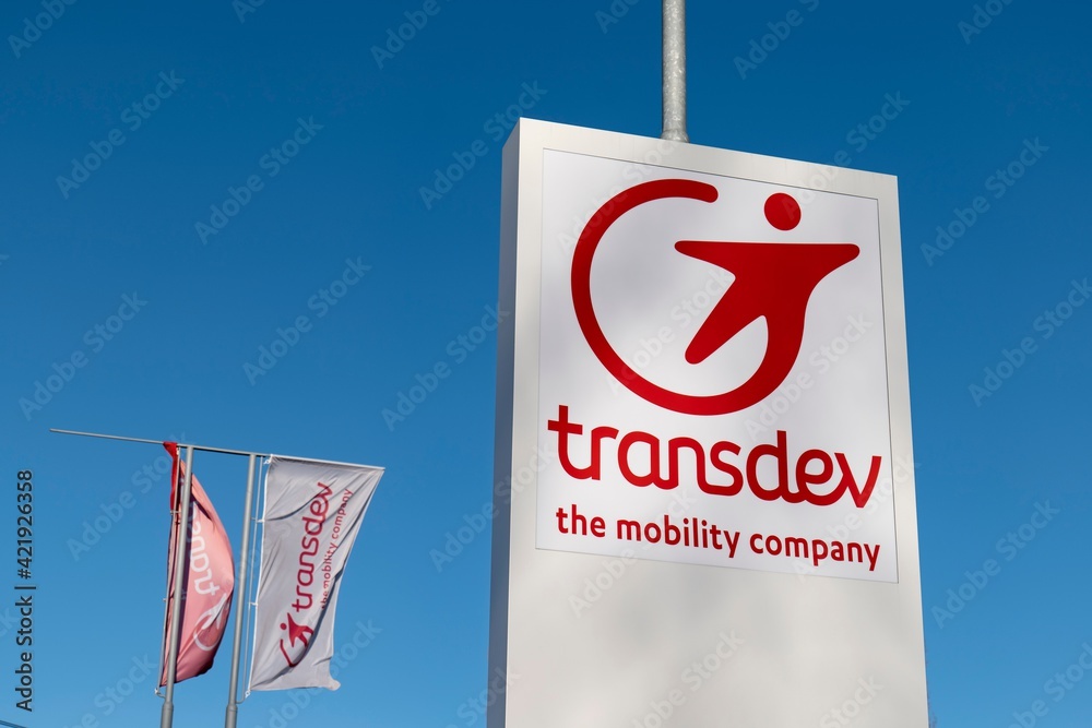 The logo of Transdev, the mobility transportation company at its ...