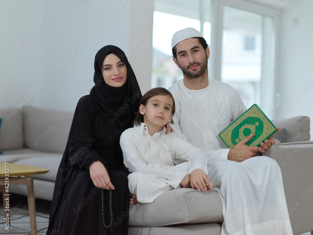Young muslim family reading Quran during Ramadan Stock Photo | Adobe Stock