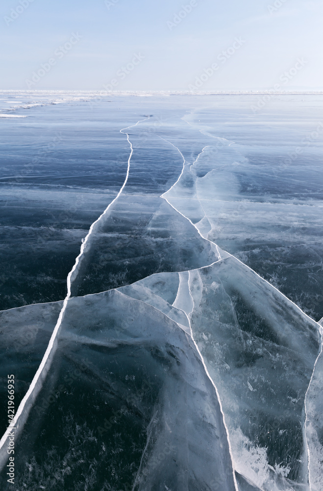 Beautiful winter natural background with thick blue transparent ice of ...