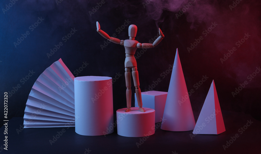 Geometric shapes, puppet with smoke in red-blue light on a black ...