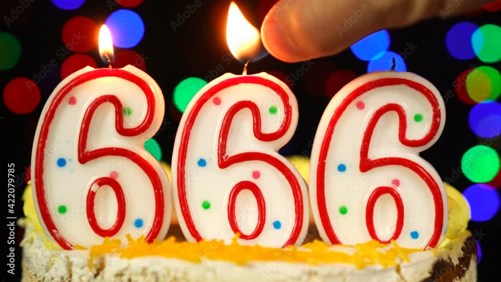 Number 666 Happy Birthday Cake With Burning Candles Topper. Stock Video | Adobe Stock