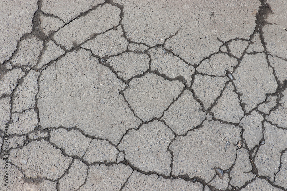 Cracked asphalt background. Old pavement texture with cracks. Stock ...