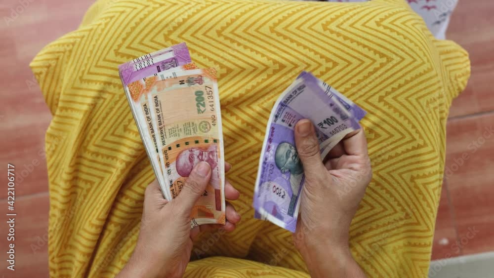Counting Indian currency Rupee , hand giving Indian money 100, 200 ...