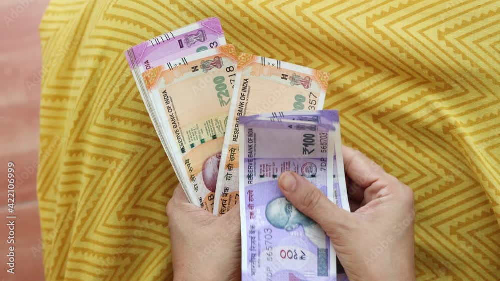 Counting Indian currency Rupee , hand giving Indian money 100, 200 ...