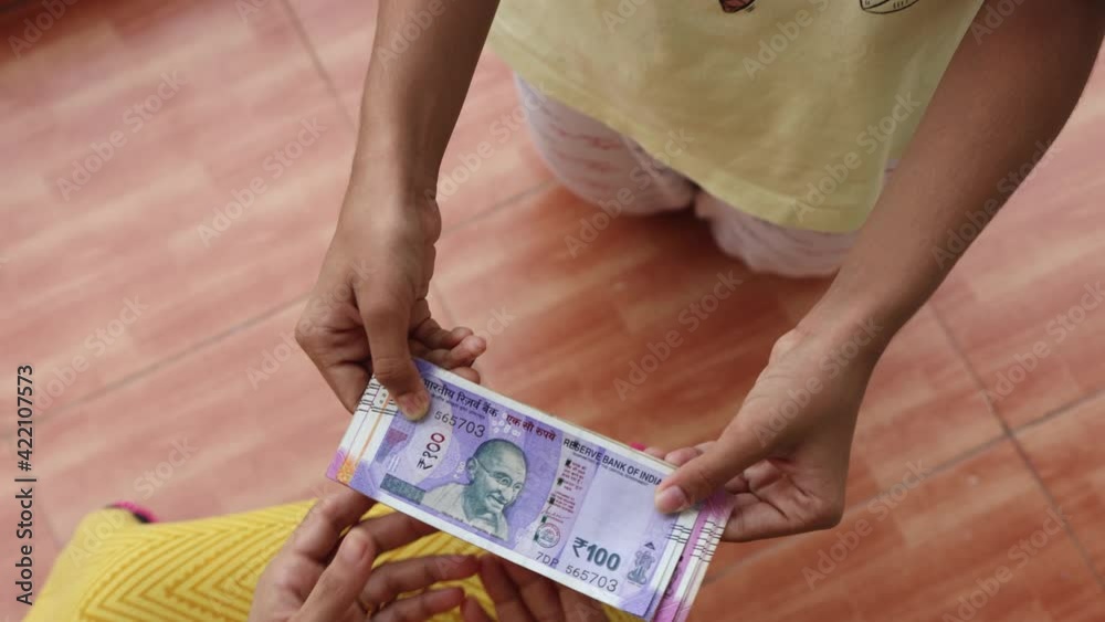 Counting Indian currency Rupee , hand giving Indian money 100, 200 ...