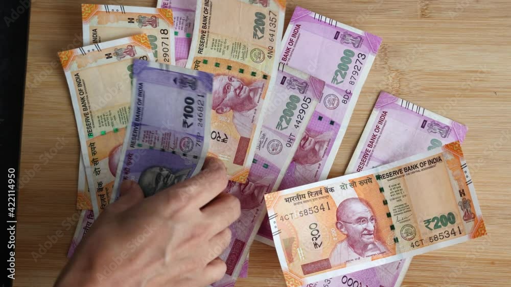Counting Indian currency Rupee , hand giving Indian money 100, 200 ...
