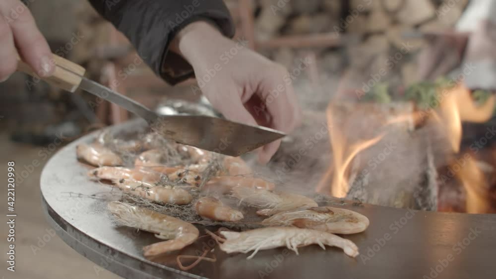 We grill vegetables and fish with shrimps. We fry seafood over open ...