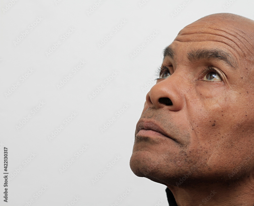 man praying to god with head looking up with grey background stock ...