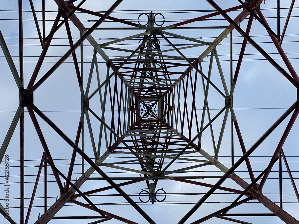 High voltage electric tower post - Bottom view revealing abstract ...