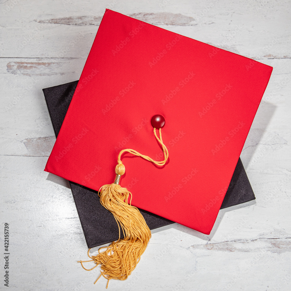 Red Graduation Cap With Gold Tassel Stock Photo | Adobe Stock