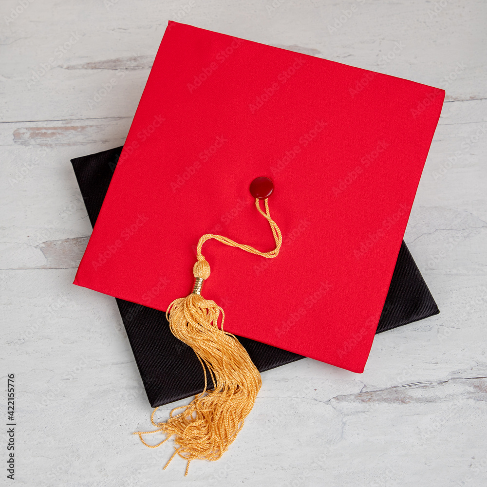 Red Graduation Cap With Gold Tassel Stock Photo | Adobe Stock