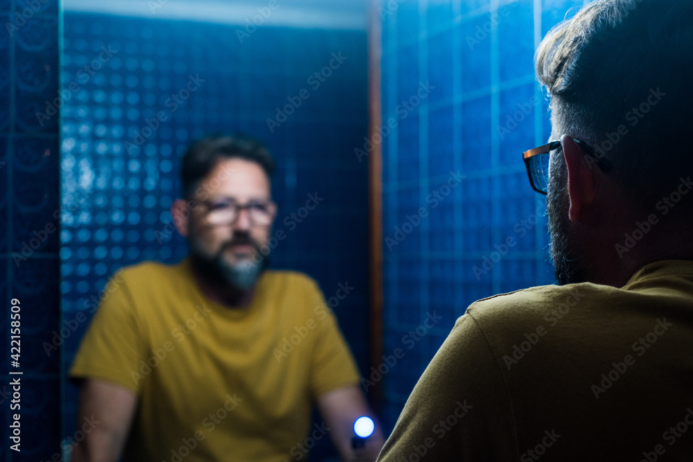 Man Looking In Mirror Sad