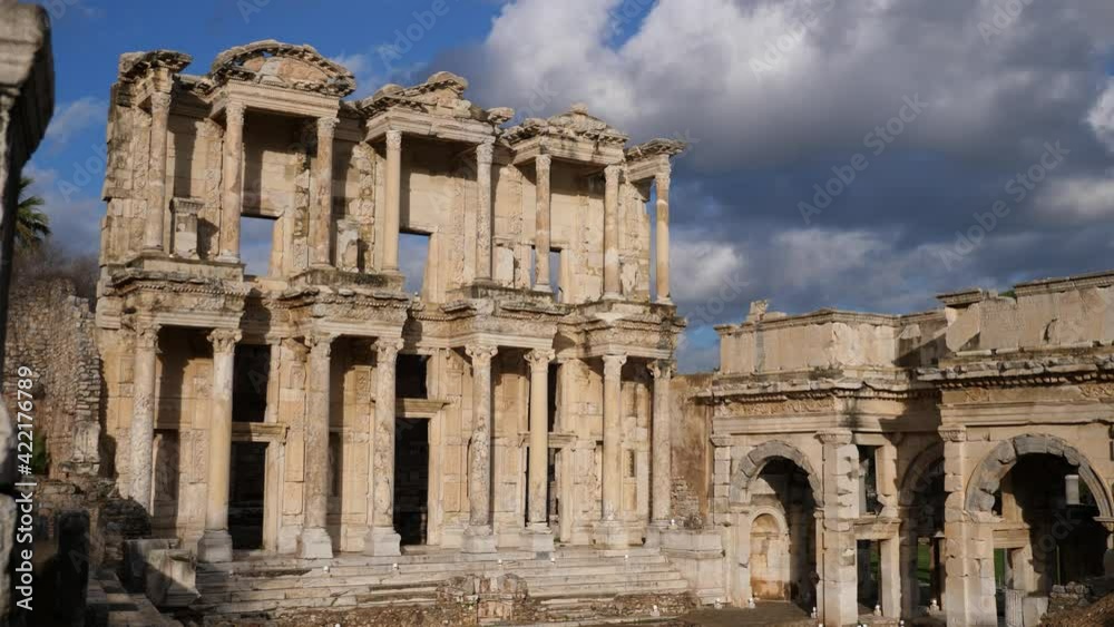 View of the decorative facade of the Library of Celsus and the Gate of ...
