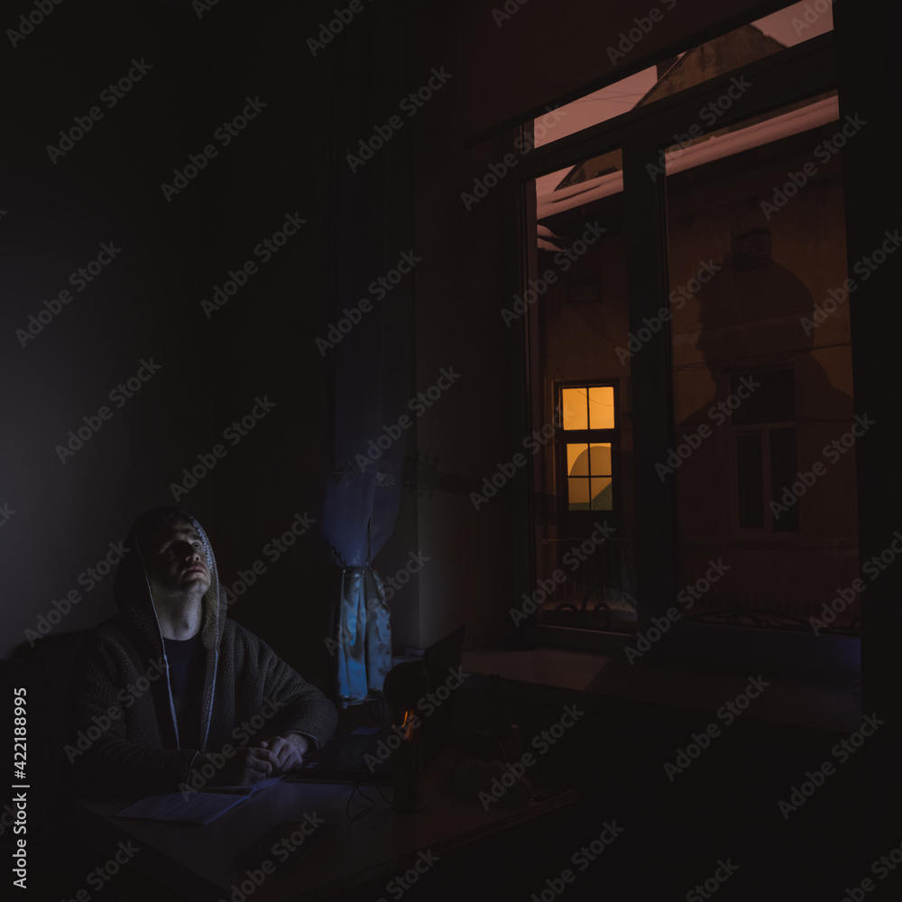 isolation and night working of middle age person programmer with laptop ...