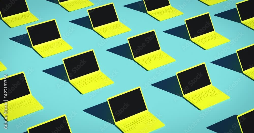Colorful array of bright yellow laptops that swing open. Overhead ...