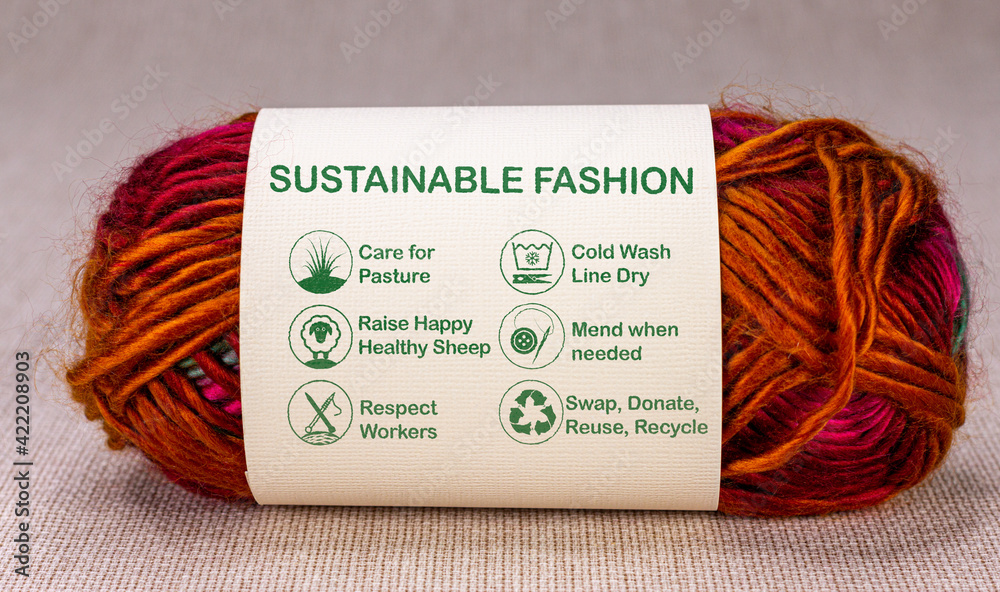 sustainable fashion label on ball of wool with care icons and text ...