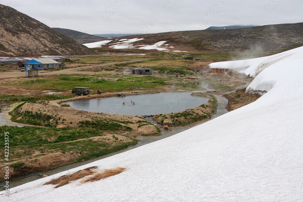 Lorino hot springs. Thermal mineral springs in the tundra in a valley ...