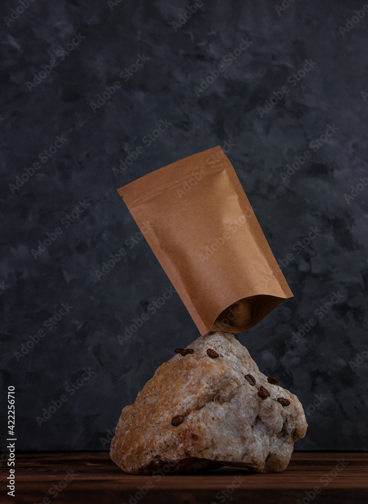 Balancing pouch bag mockup on natural stone. Blank kraft paper pack ...