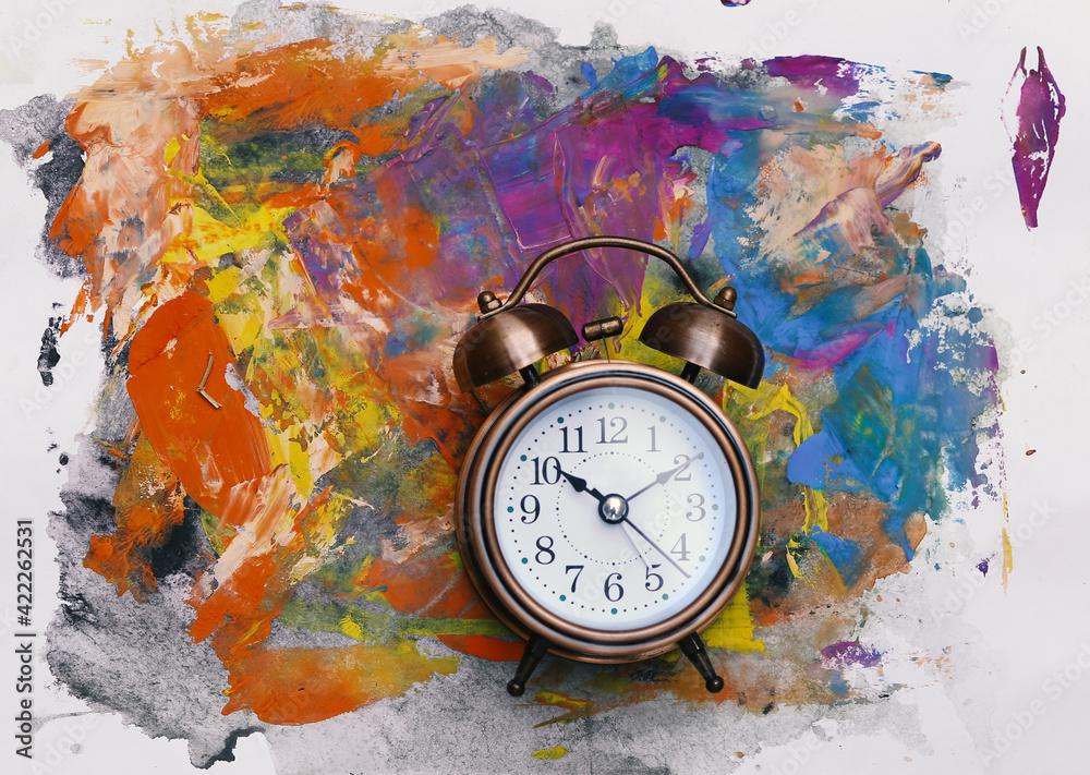 Person With Abstract Clock Paintings