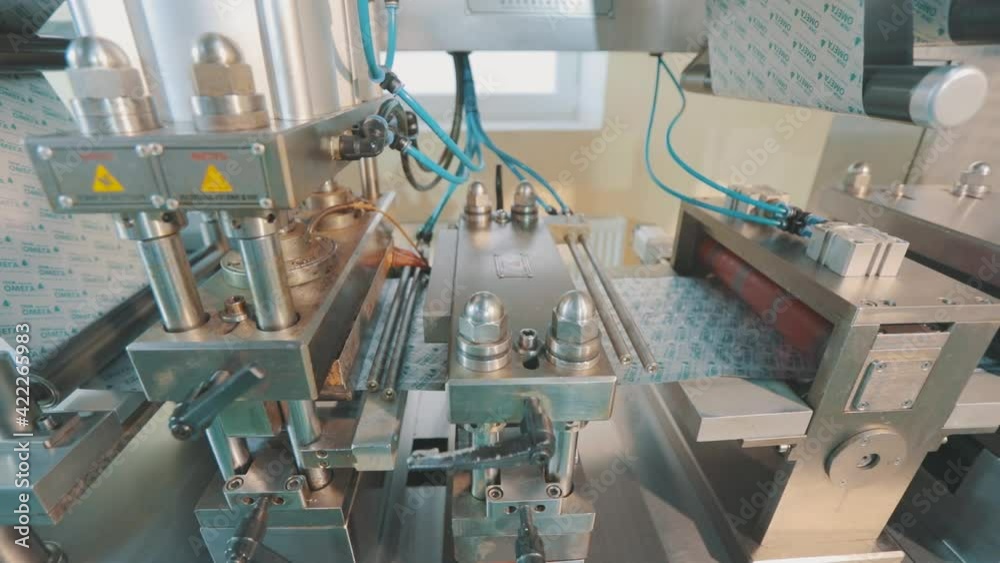 Blister packing of tablets. Tablet manufacturing process. Industrial ...