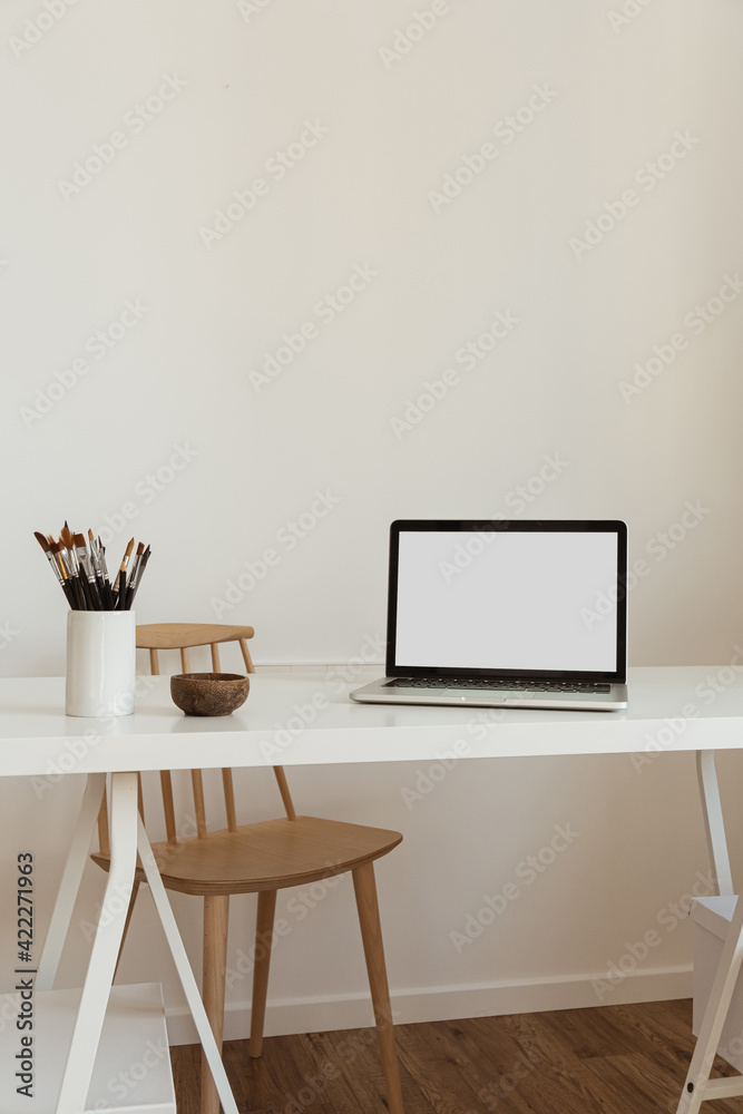 Laptop computer with blank screen on table. Aesthetic minimal office ...