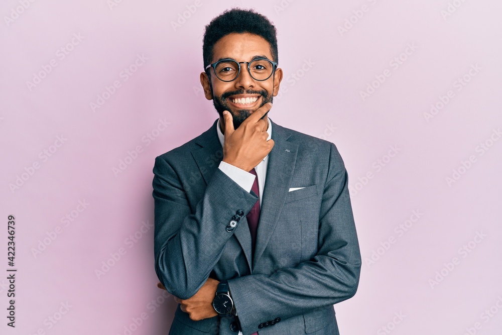 Handsome hispanic business man with beard wearing business suit and tie ...