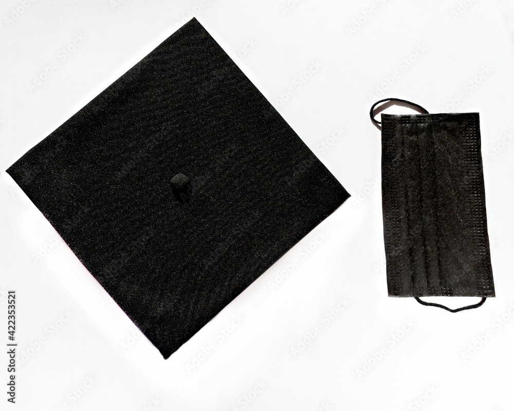 Graduate black cap and protective face mask on white background ...