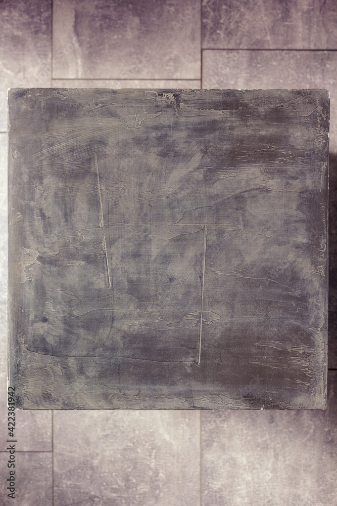 Grey or gray cube table at floor texture. Modern architecture concept ...