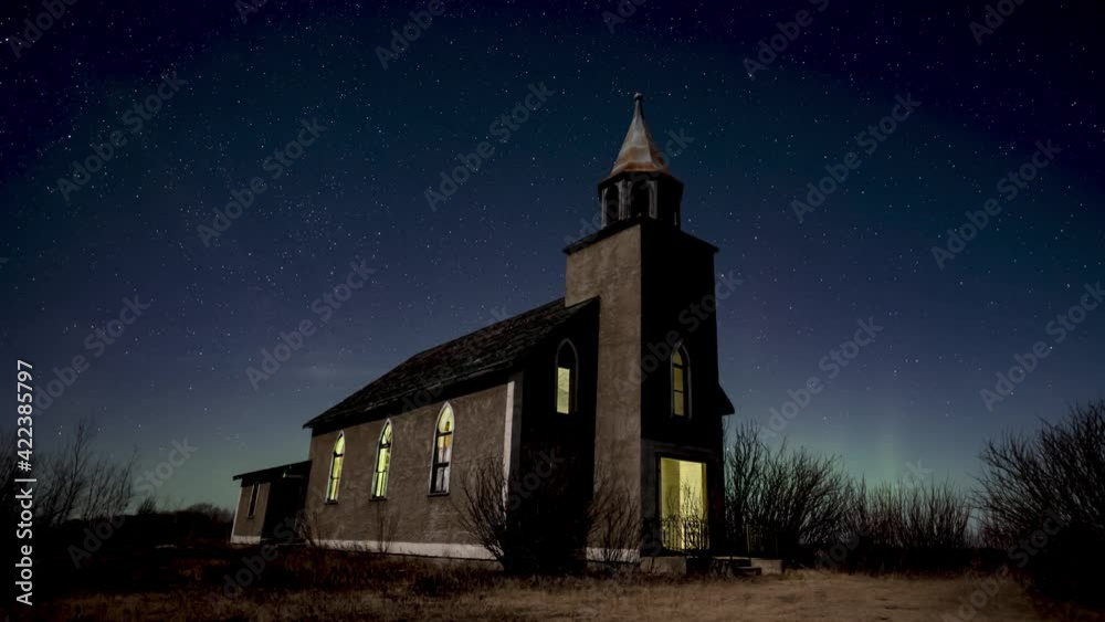 An abandoned dilapidated church with light coming through broken ...