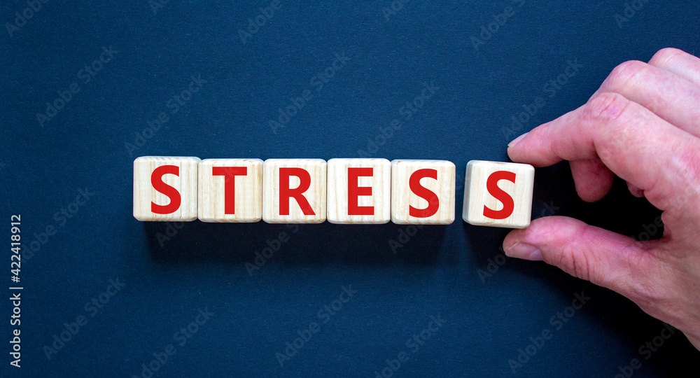 Stop stress and be health symbol. Doctor holds cubes with the word ...