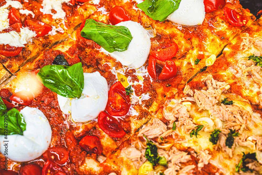 Detail of pizzeria counter with gormet type of pizza display. Italian ...