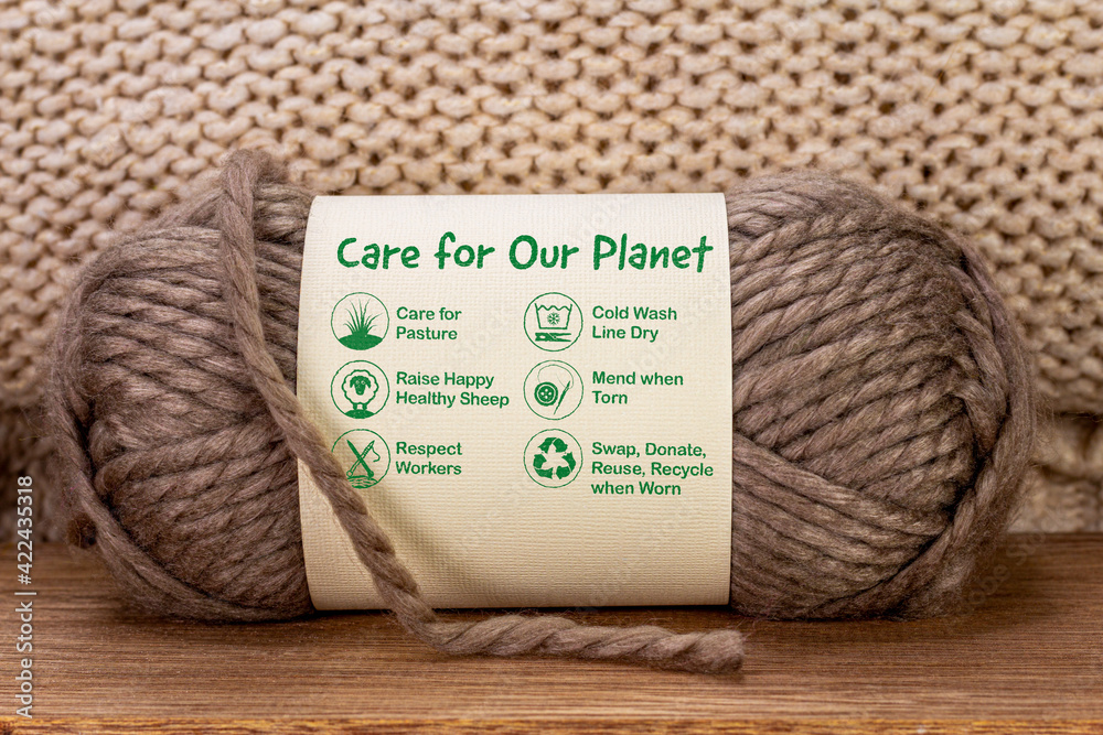 Care for our planet label on ball of wool with care icons and text ...