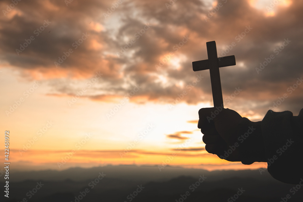 Human hands holding a cross holy and prayed for blessings from God ...
