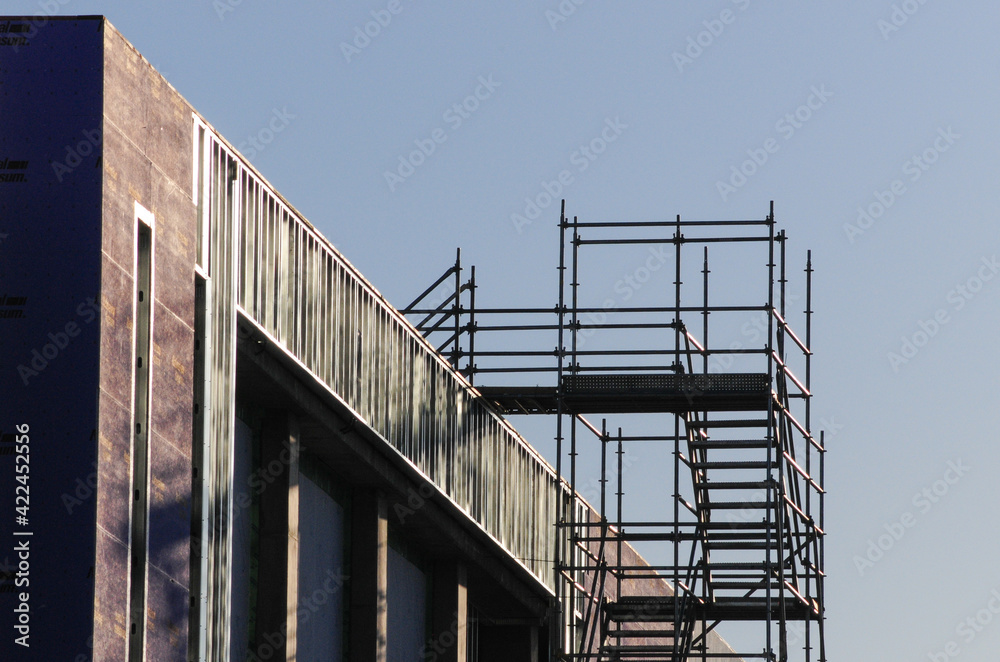 Scaffolding at construction site of new building Stock Photo | Adobe Stock