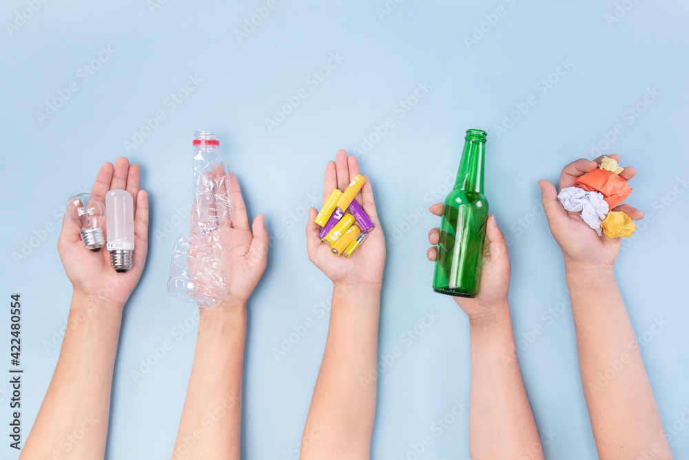 Five types of garbage in human hands Stock Photo | Adobe Stock