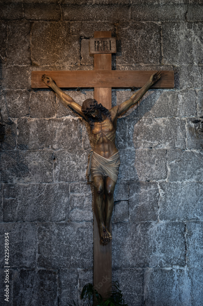 Sculpture of Jesus crucified in a church Stock Photo | Adobe Stock