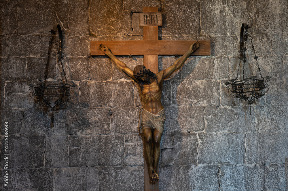 Sculpture of Jesus crucified in a church Stock Photo | Adobe Stock
