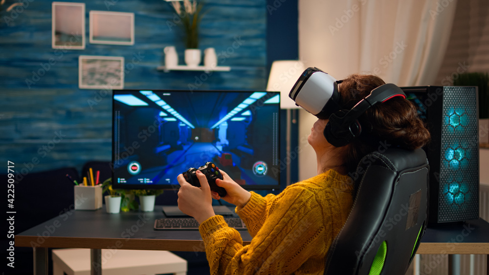 Professional gamer wearing virtual reality headset using wireless ...