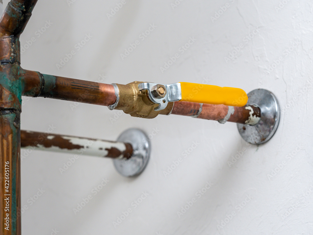 Water shut off valve. Copper plumbing pipe with brass water supply ...