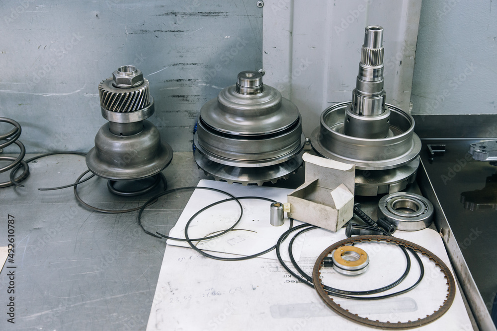 Set of various engine and gearbox spare parts. Shiny gears for ...