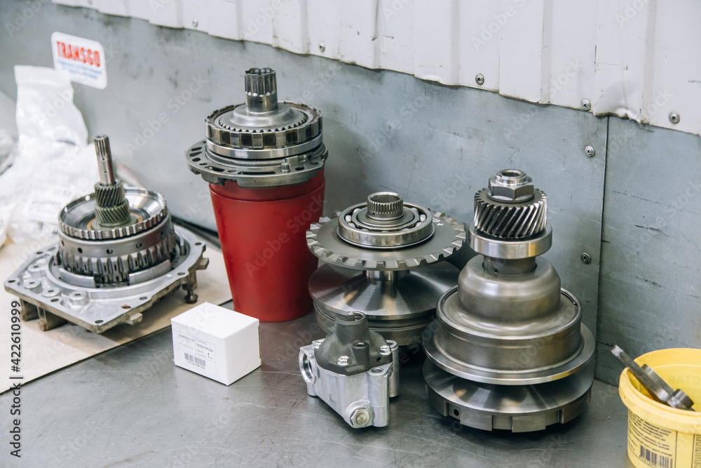 Set of various engine and gearbox spare parts. Shiny gears for ...