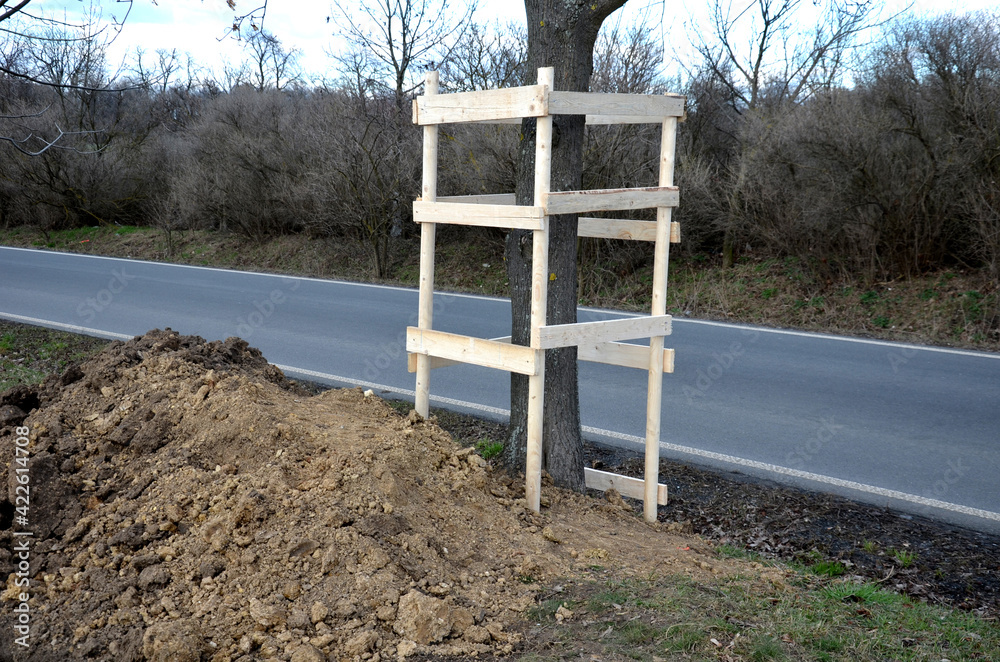 protection of tree trunks on a construction site. the trees in the ...