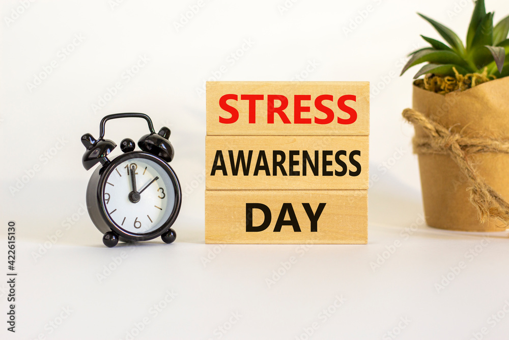 Stress awareness day symbol. Wooden blocks with words 'Stress awareness ...