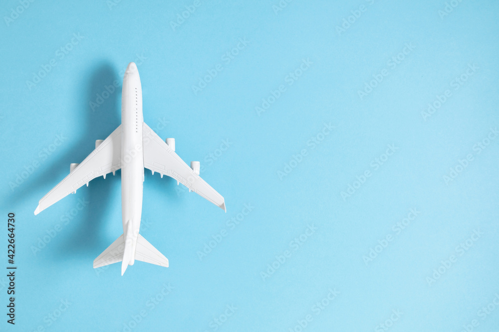 Airplane model. White plane on pastel blue background. Travel vacation ...
