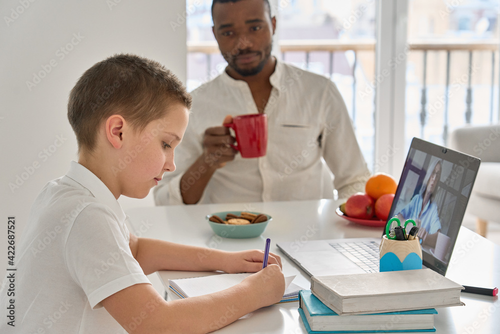 Foto de Caucasian teenage school boy son distance learning remote ...